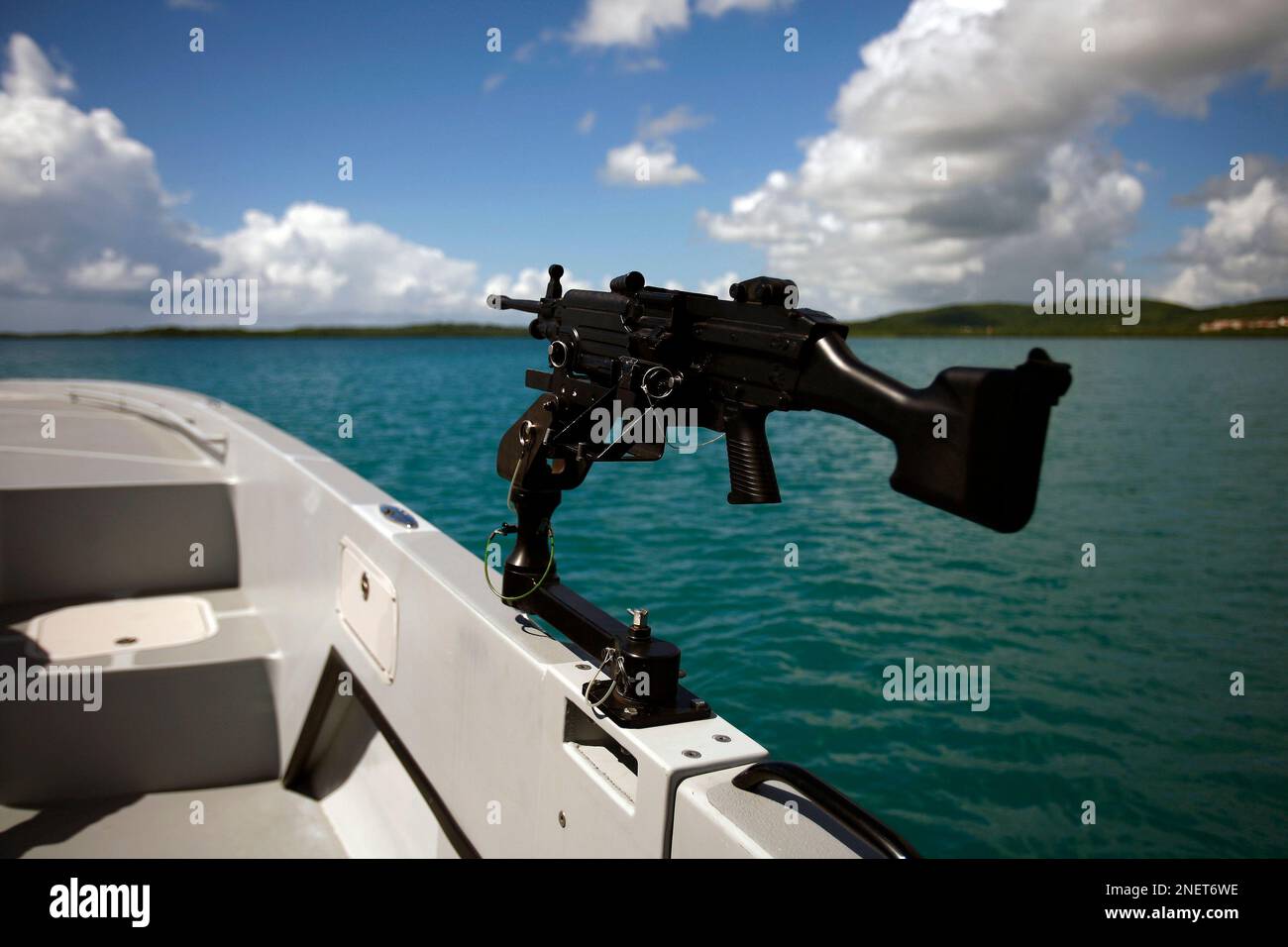 A machine gun sits mounted on a prototype boat for the US Border Patrol ...