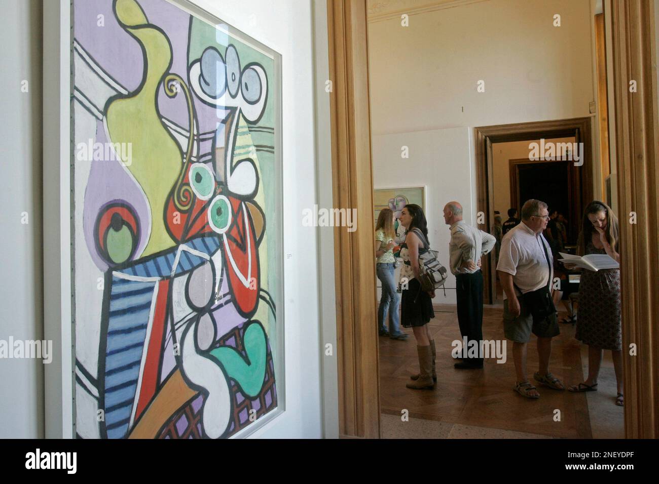 Visitors watch works by Spanish Artist Pablo Picasso at Paris Picasso ...