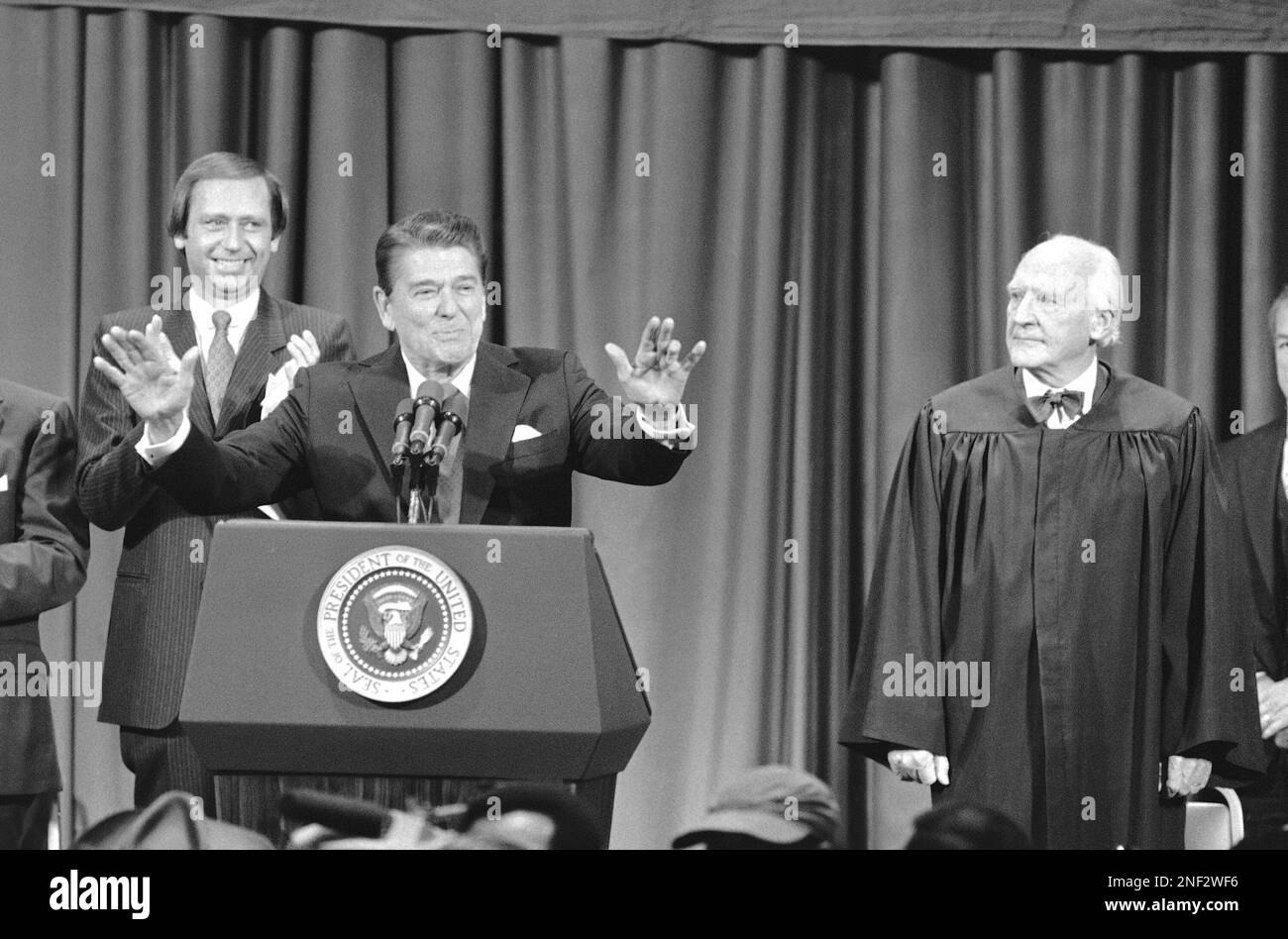 President Ronald Reagan gestures during naturalization ceremony at ...