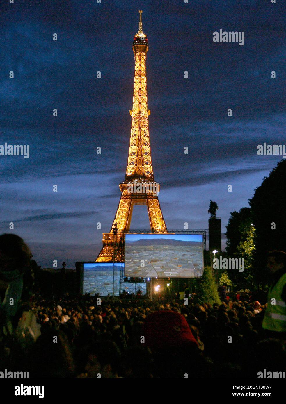 People watch French photographer Yann Arthus-Bertrand's movie "Home" on ...