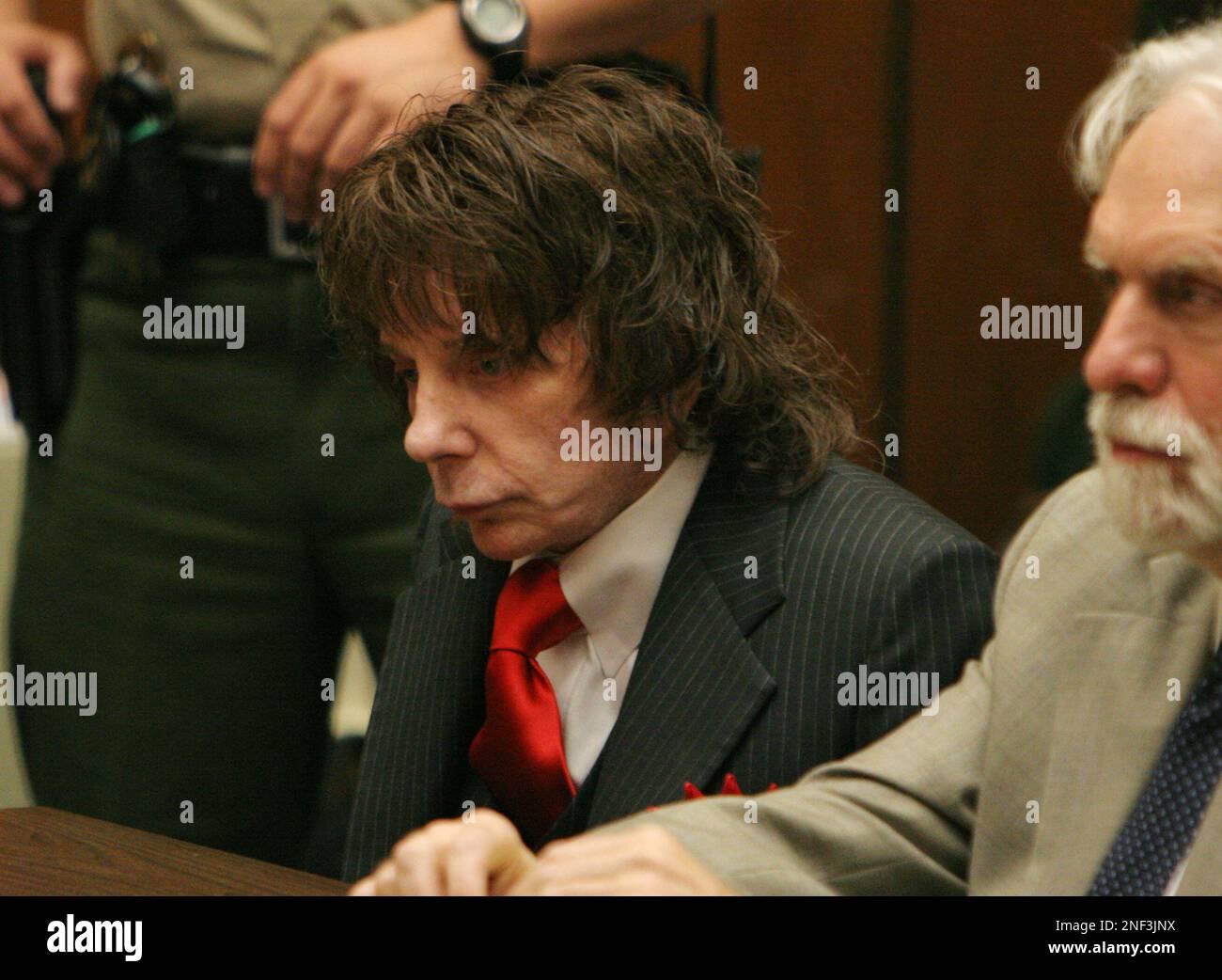 Music producer Phil Spector, center, and his attorney Dennis Riordan ...