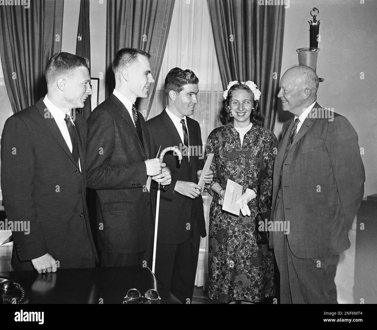 President Dwight Eisenhower chats at the White House in Washington, on ...
