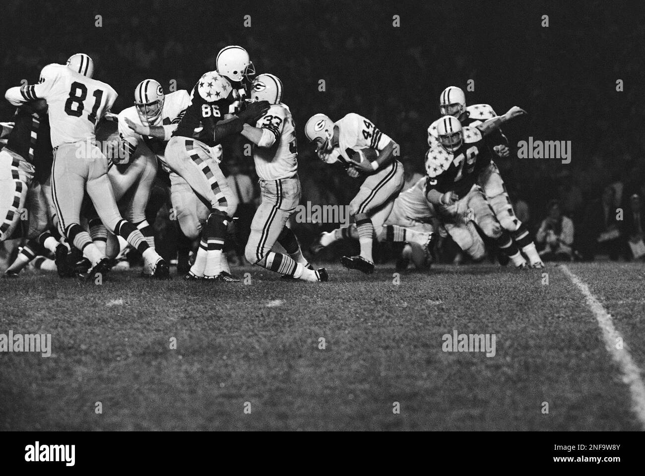 Don Anderson (44), Green Bay Packers' halfback, busts through College ...