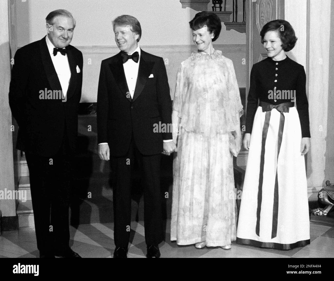 President Jimmy Carter, second from left, holds hands with Audrey ...
