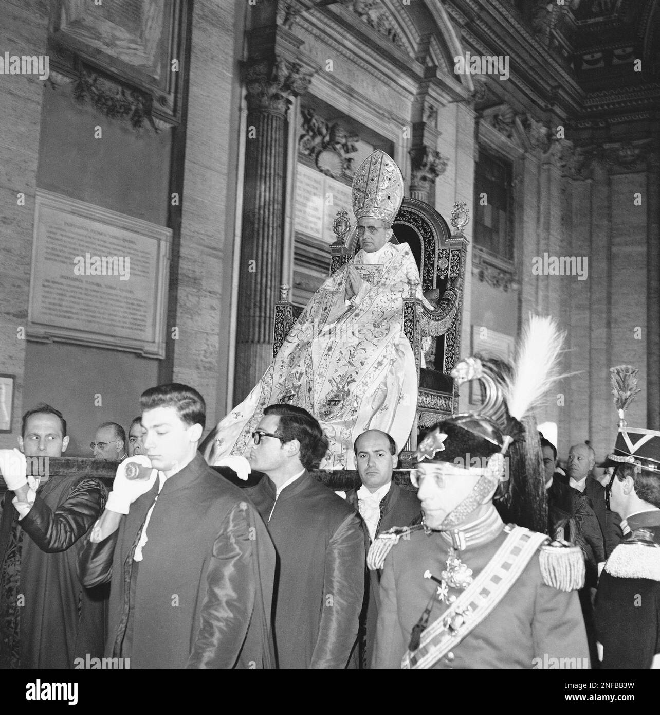 Pope Paul VI, wearing mitre, is carried into St. Peter's Basilica in ...