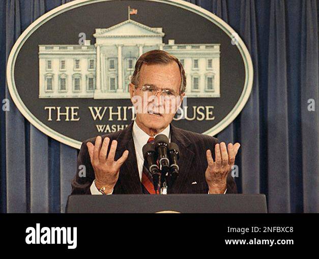 President George Bush gestures while holding a White House news ...