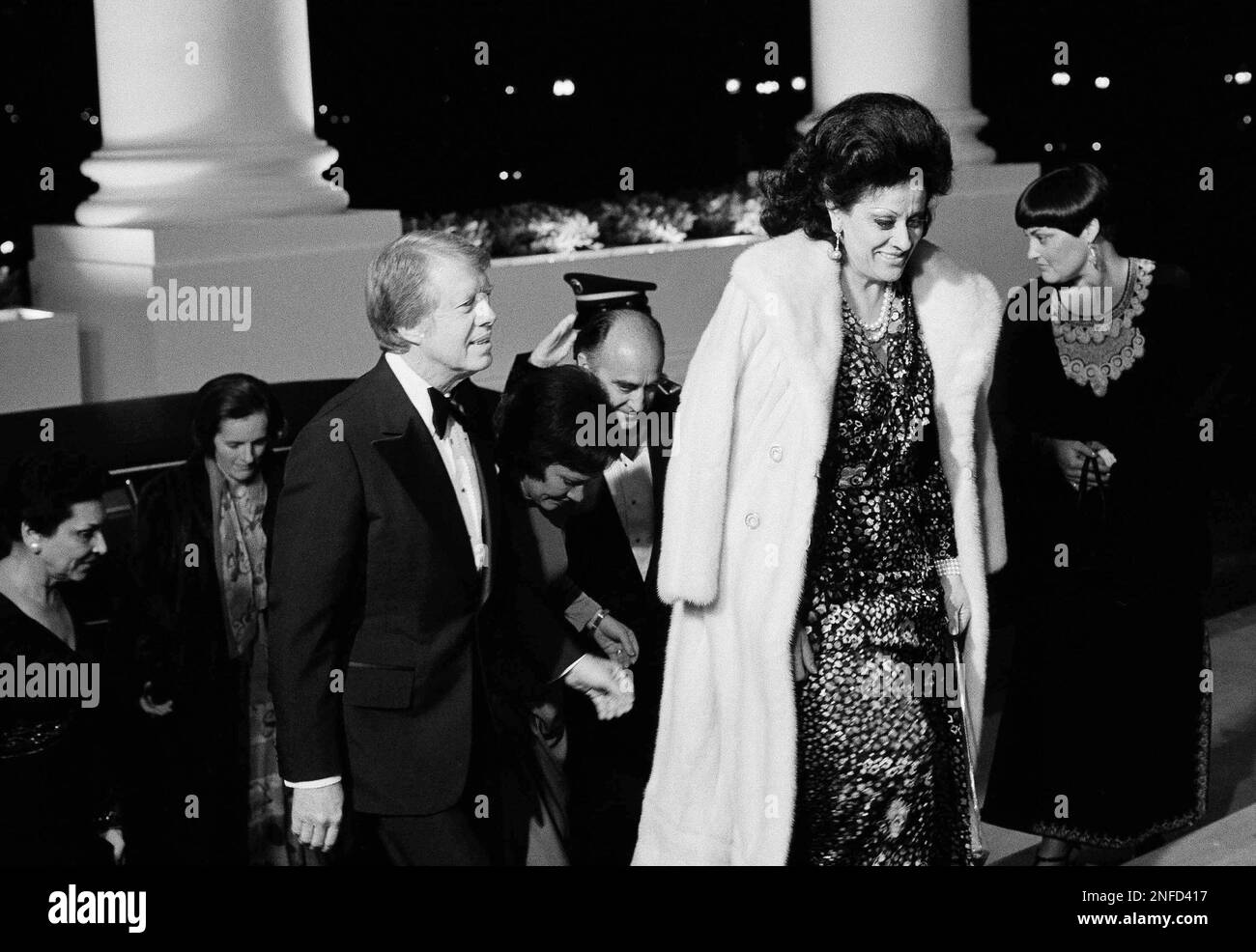 President Jimmy Carter walks with Carmen Romano de Lopez Portillo, wife ...