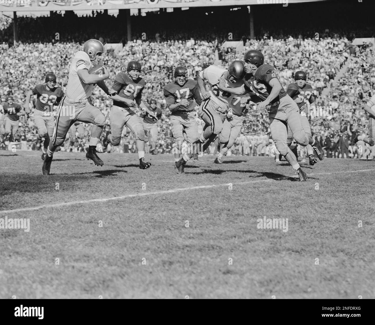 Texas Tech back George Volkert sprints for 23 yards, with teammate ...