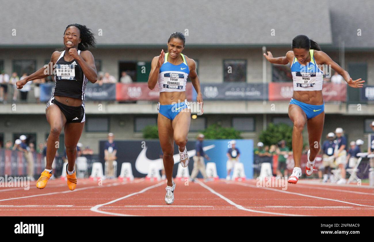 Muna Lee, right, crosses the finish line ahead of Torri Edwards and ...