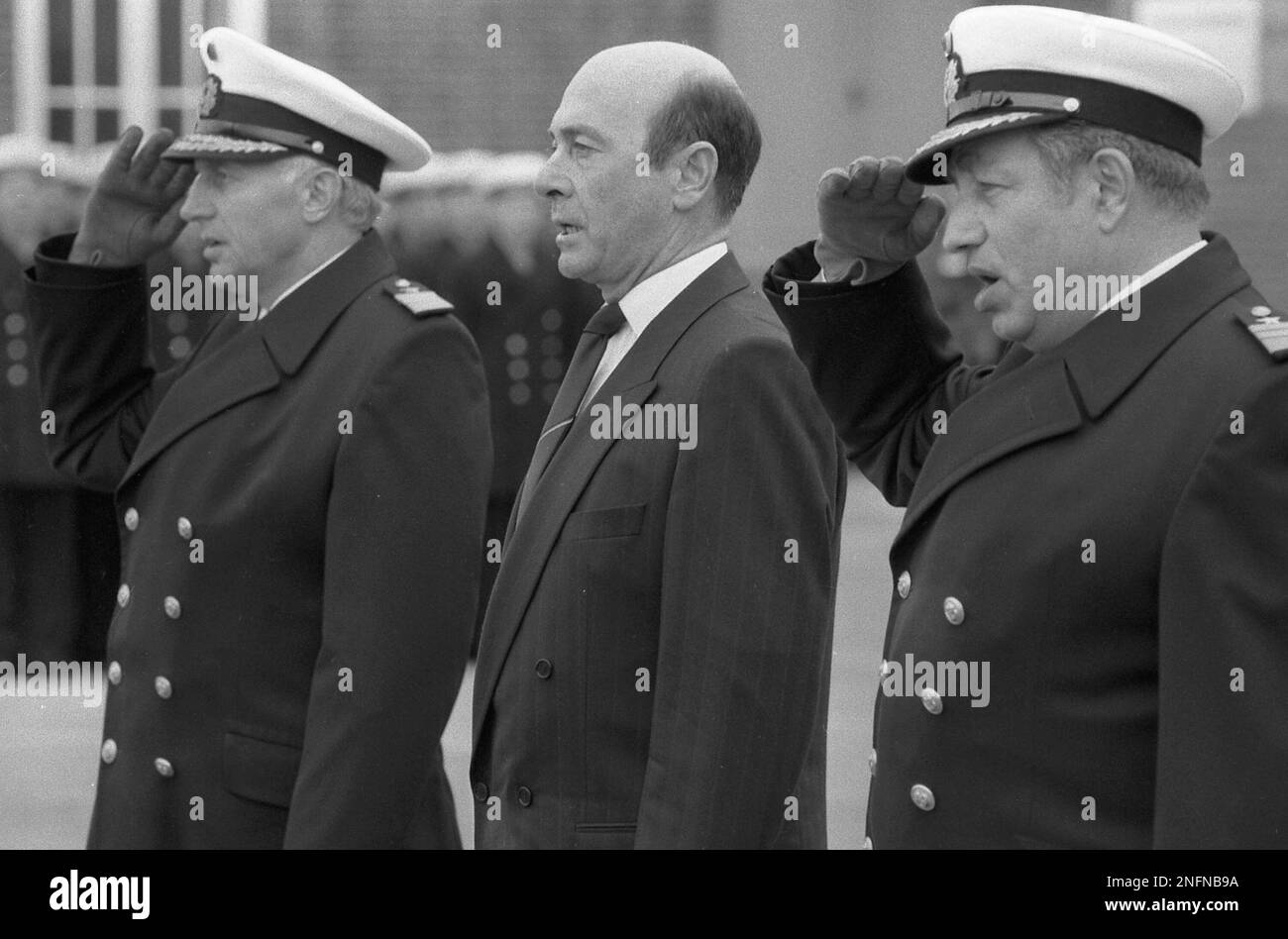 West German minister of defence, Manfred Woerner, is flanked by the new ...