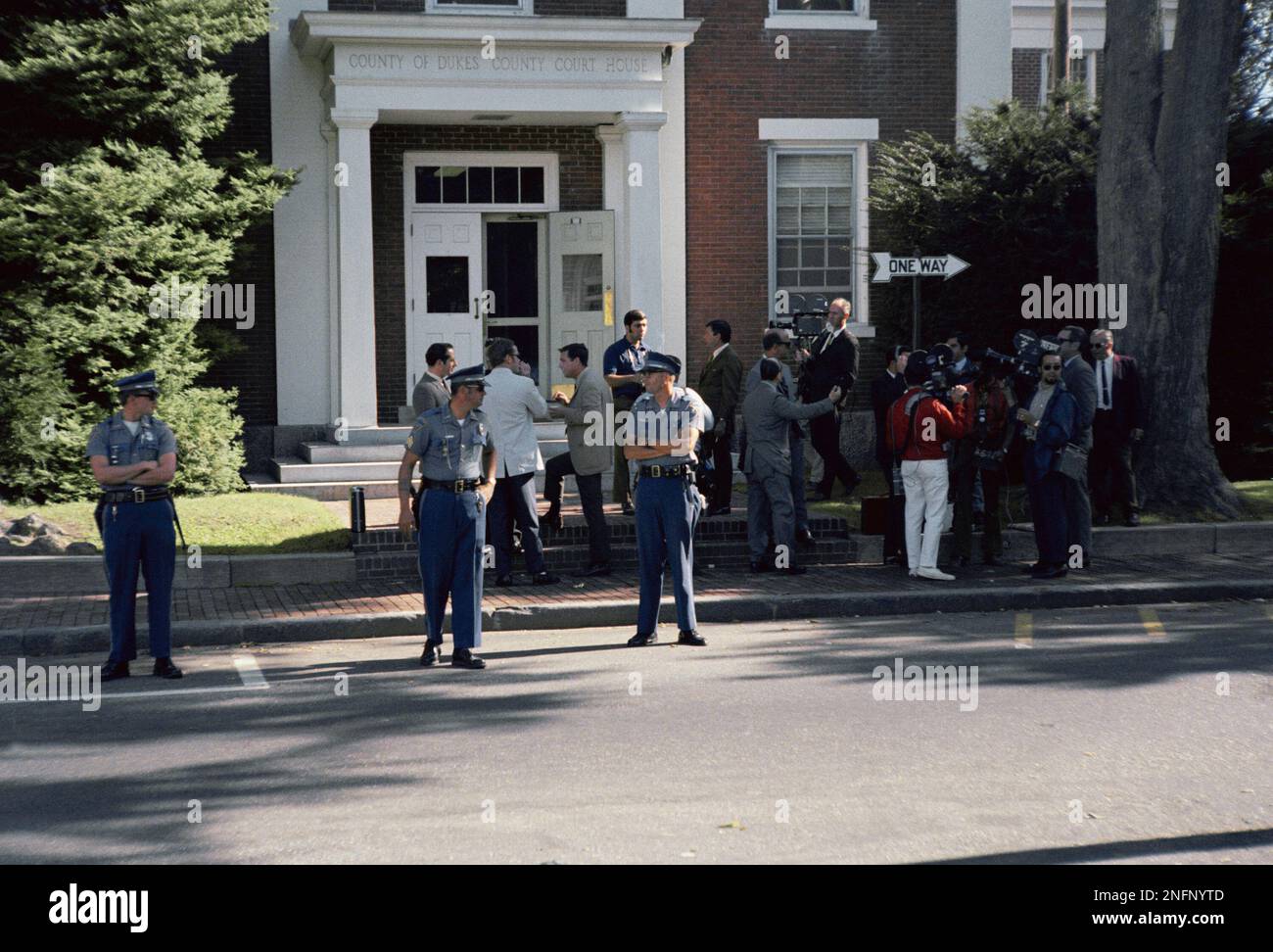 Police join reporters and spectators in front of Dukes County ...