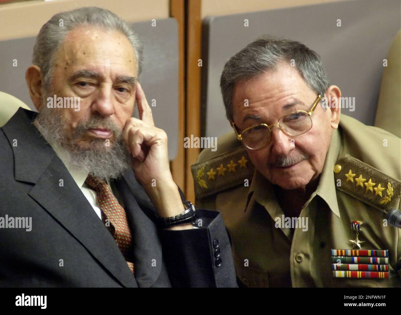 ** FILE ** Cuban President Fidel Castro, left, and his brother ...