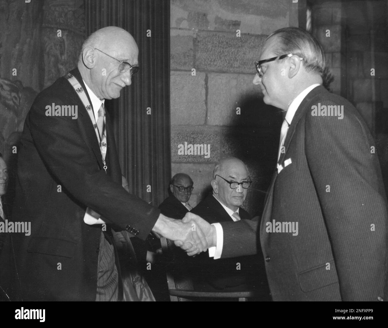 Robert Schuman, left, is congratulated by West German Foreign Minister ...