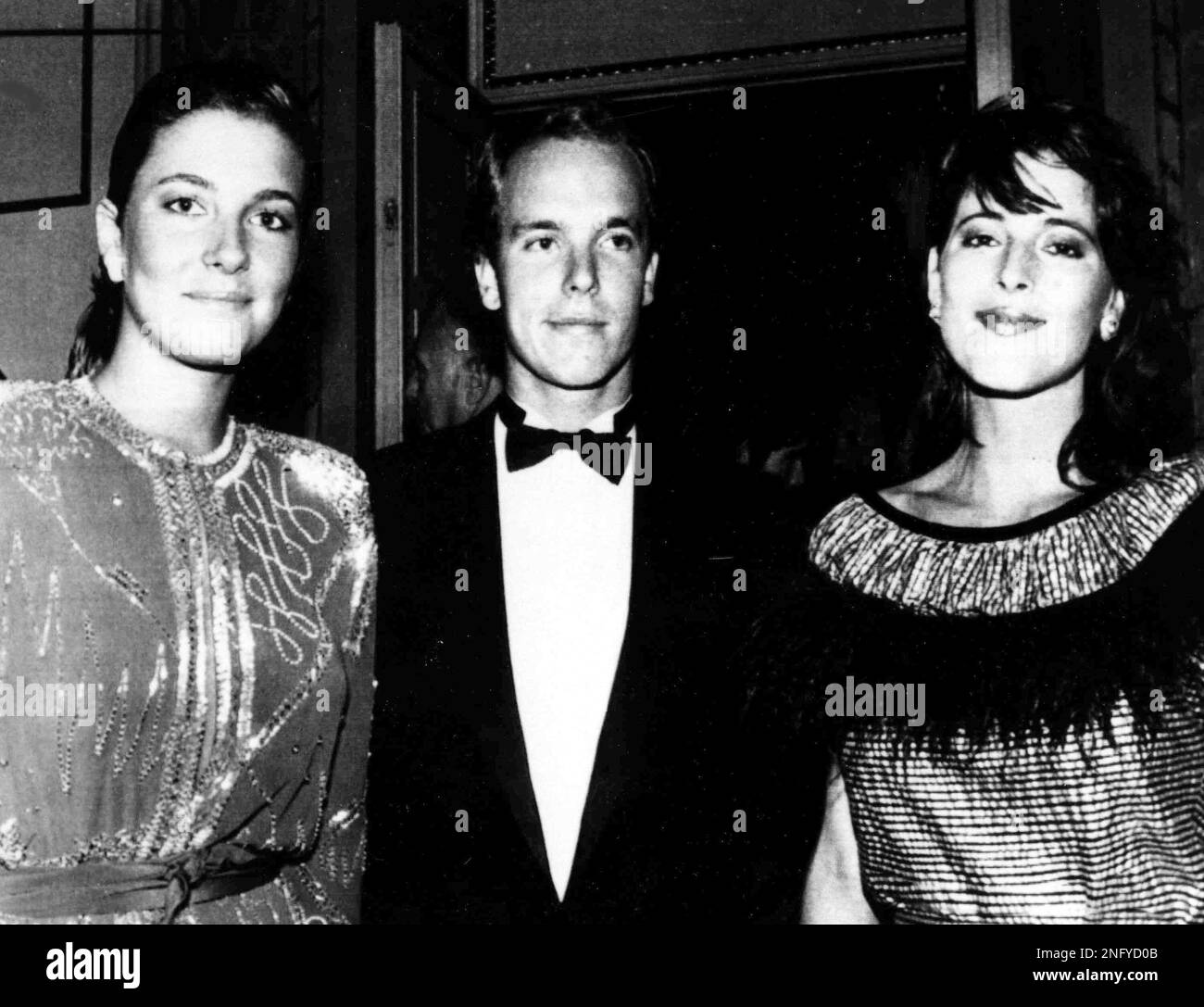 Prince Albert of Monaco poses for photographers with Debora Moore, left ...