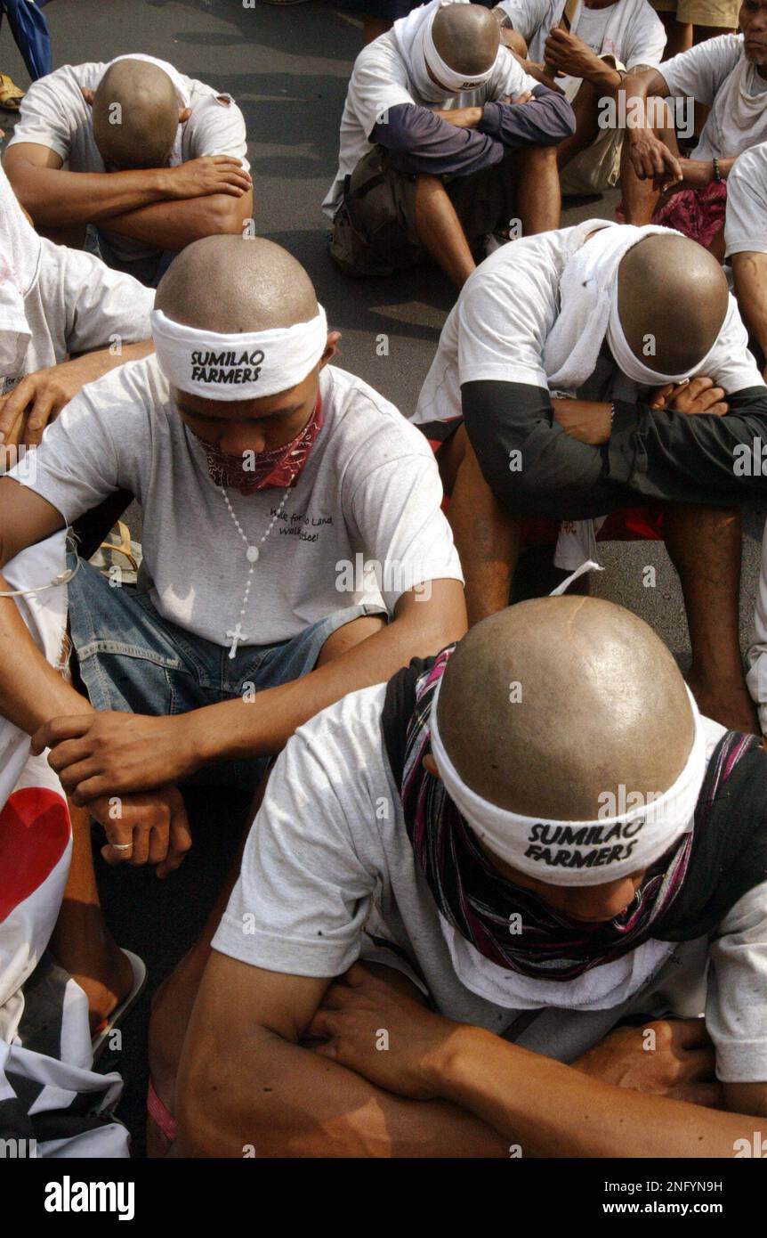 Farmer land reform beneficiaries known as Sumilao Farmers rest at an ...