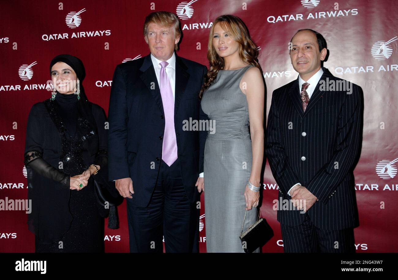 Qatar Airways CEO Akbar Al Baker, right poses with his wife Samara, left, and Donald Trump with ...