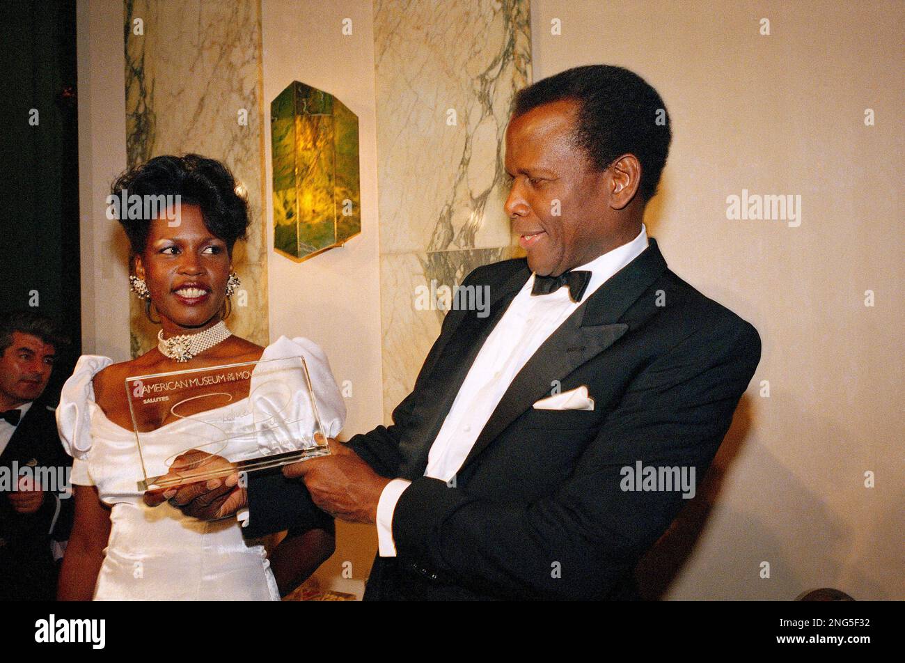 Actor Sidney Poitier and his daughter Pamela, at left, get a good look ...