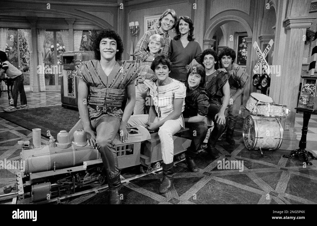 Members of the teenage singing group Menudo take a time out from taping ...