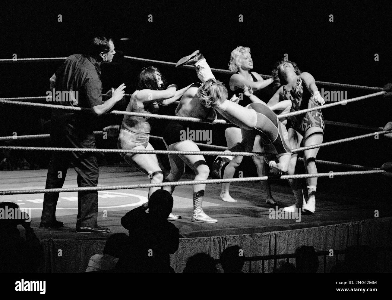 Legs, arms and bodies entangle as five of seven girls in a battle royal ...