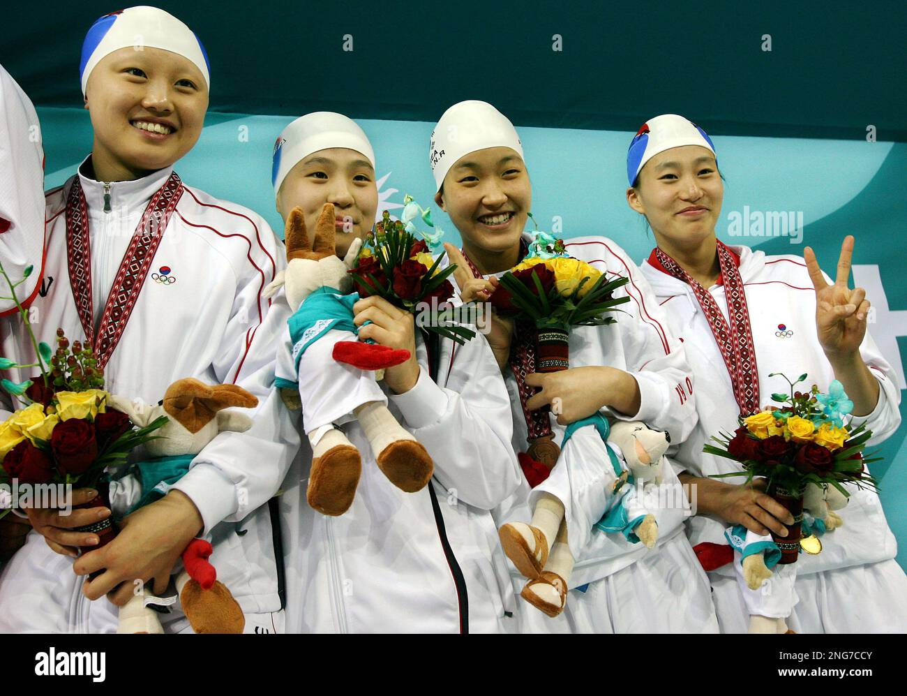 Members of the South Korean team pose with the silver medals they won in the final of the Women ...