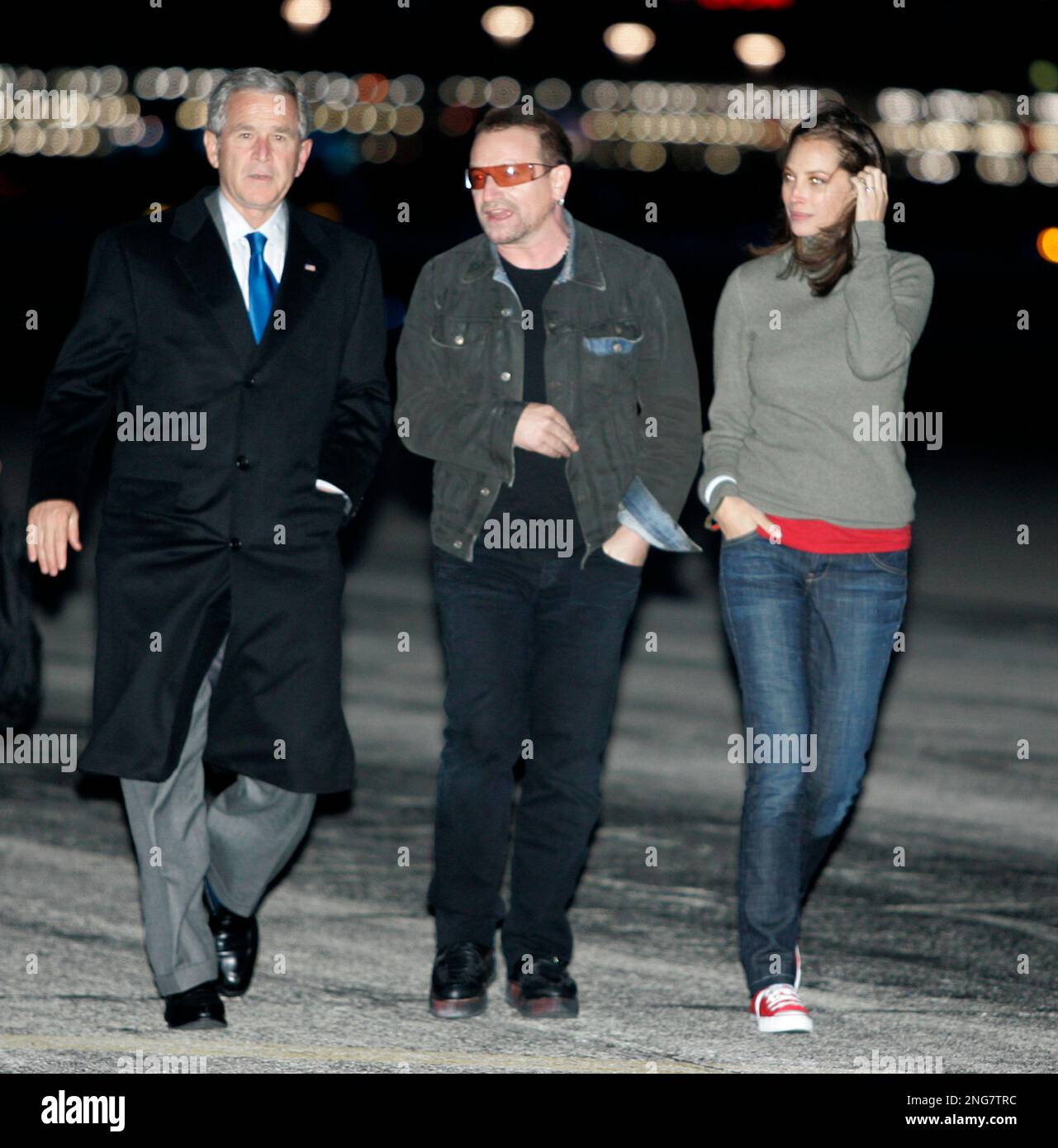 President Bush, left, walks with rock singer Bono, center, and model ...