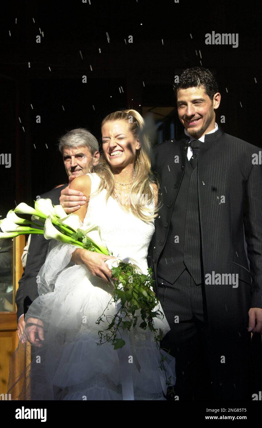 Italy's soccer national team goalie Francesco Toldo holds Manuela Pozza ...