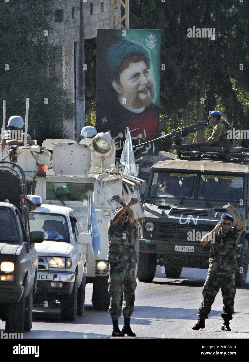 Lebanese soldier gestures next to a French U.N armored personnel ...