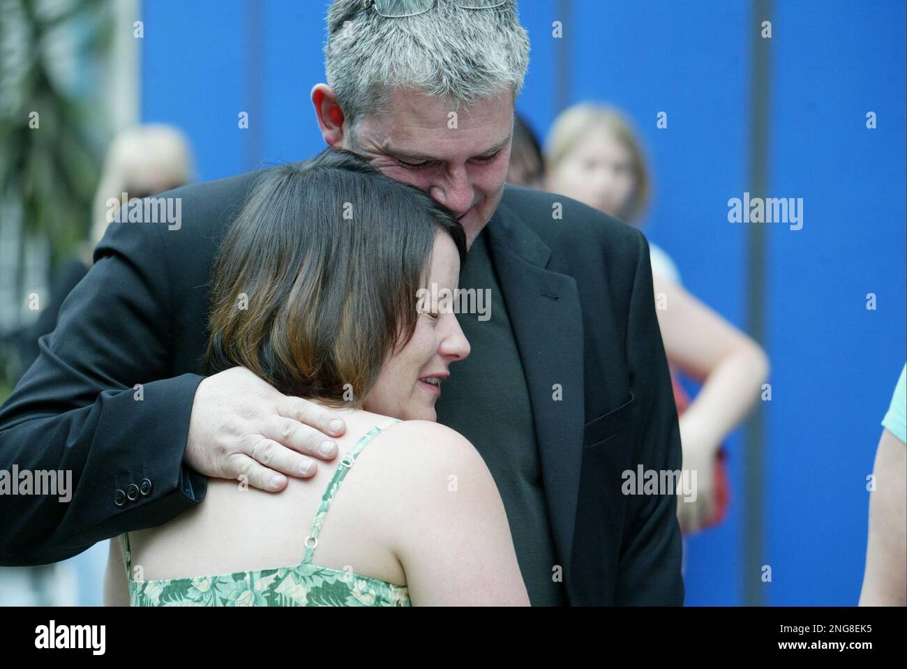 Susan Harrison, a victim of last year's London Bombing, receives a hug ...