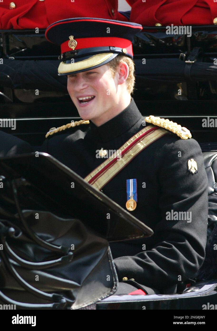 Britain's Prince Harry in an open horse drawn carriage leaves Buckingham Palace for Horse Guards ...