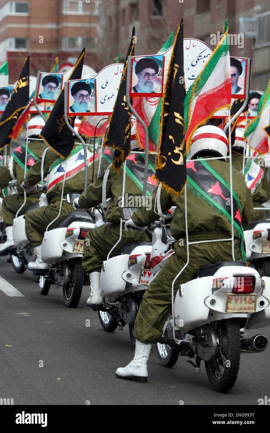 Iranian police officers ride motorcycles with posters of Iran's supreme ...