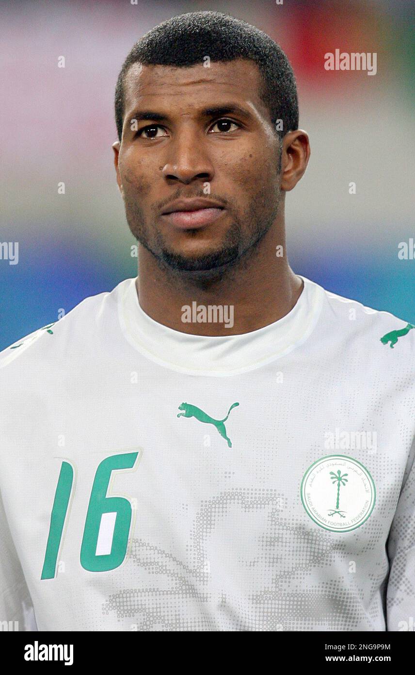 Khaled Aziz A. Thaker of Saudi Arabia listens to the national anthem ...