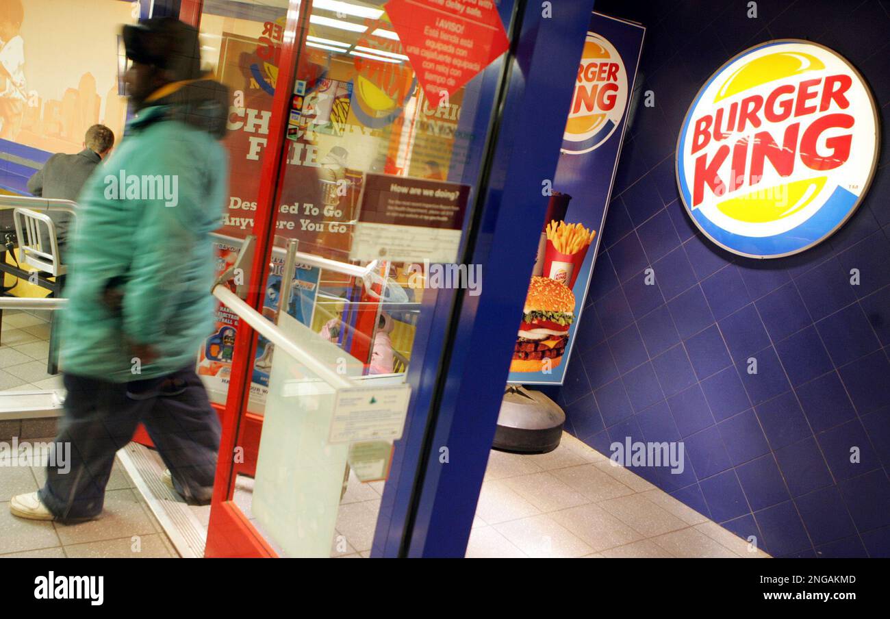 A man enters the Burger King fast - food restaurant in Midtown ...