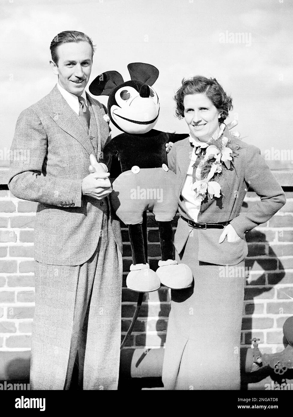 U.S. cartoonist Walt Disney poses with his wife Lillian and one of his ...