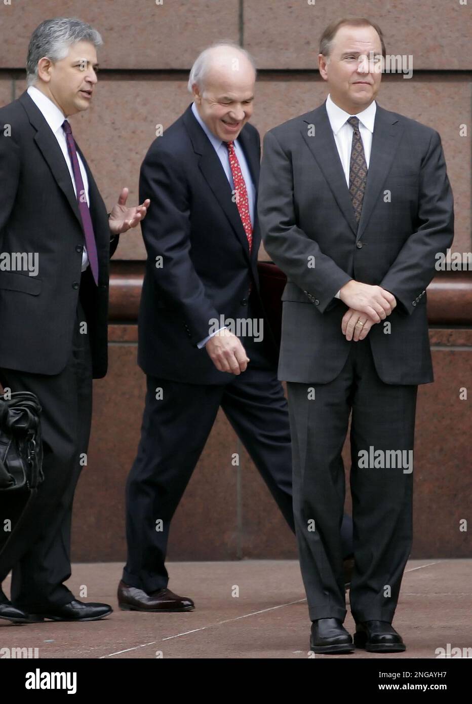 Former Enron CEO Jeffrey Skilling, right, waits to cross the street as ...