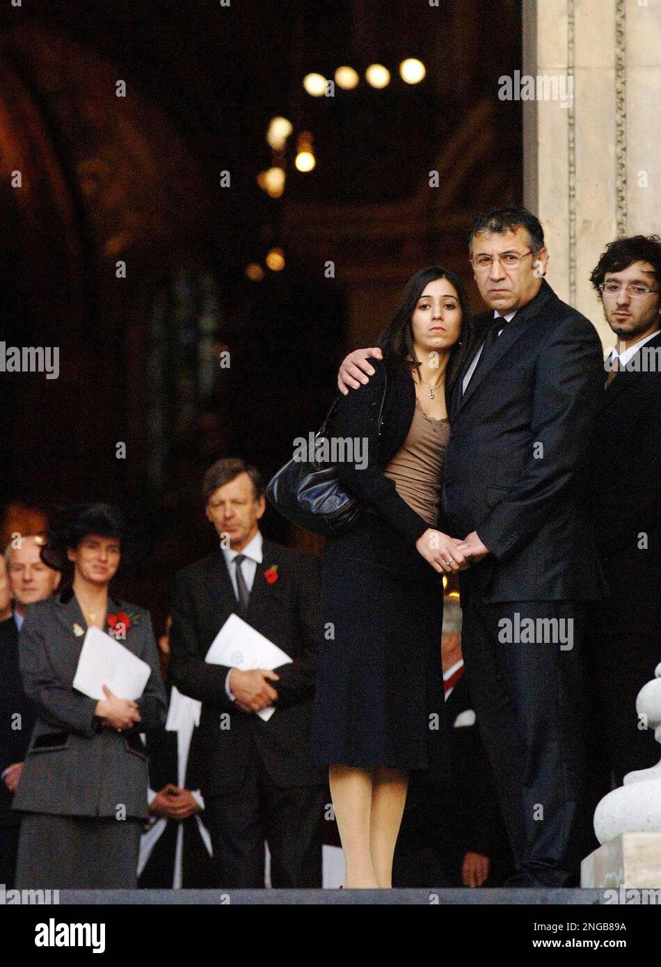 (Front, from left) Saba, Nader and Saeed Mozakka leave St Paul's ...