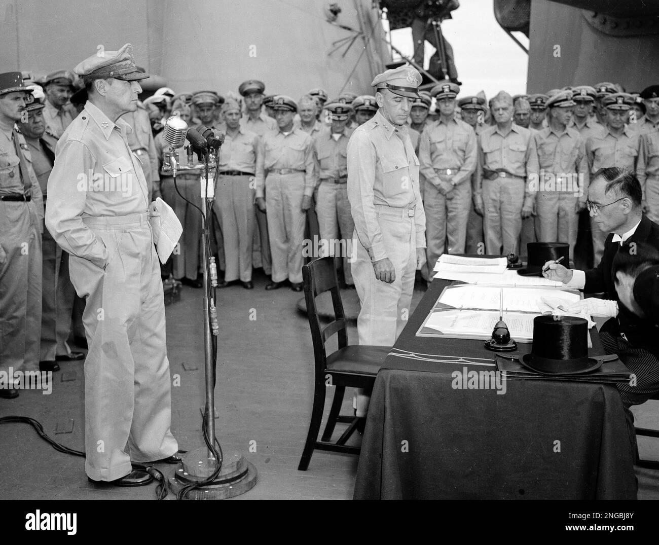 U.S. General Douglas MacArthur, left, watches as the foreign minister ...