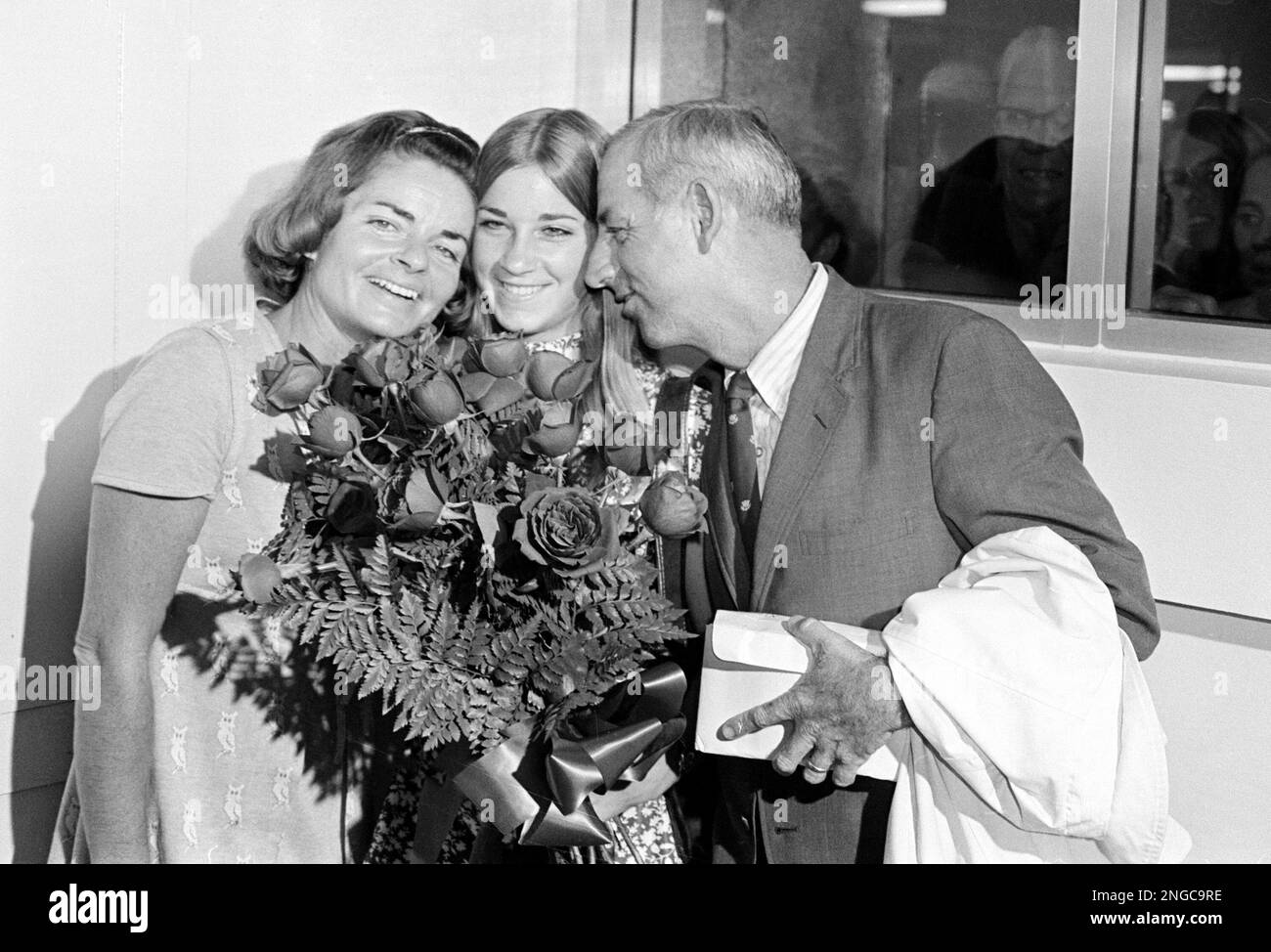 Chris Evert, 16-year-old tennis star, center, is hugged by her mother ...