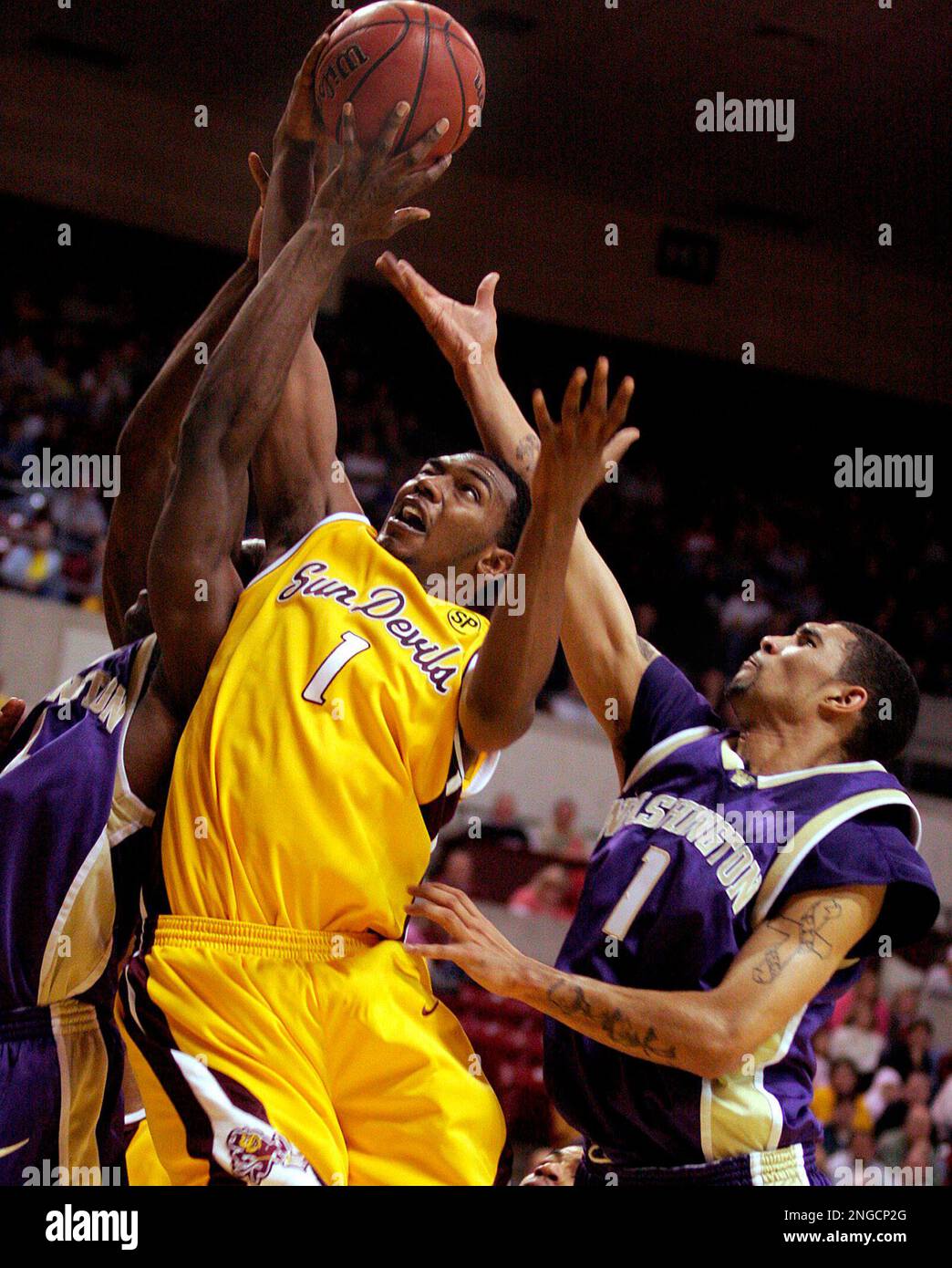 Arizona State guard Jason Braxton, center, pulls in an offensive ...