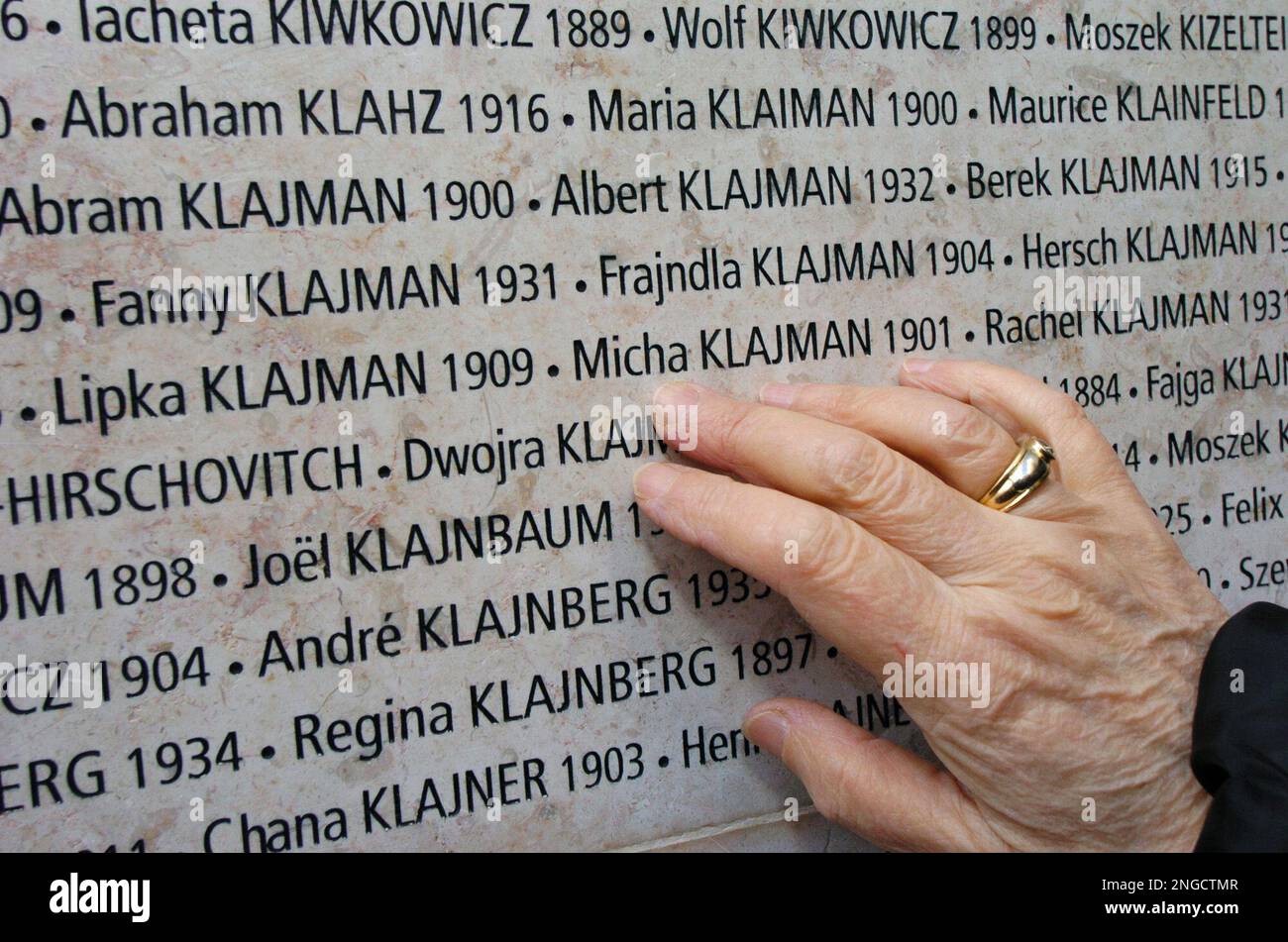 Rosette Klajman points to the name of her mother Micha engraved on the ...