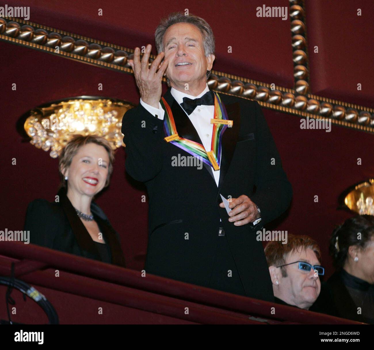 Actor, producer, and writer Warren Beatty, center, gestures from the ...