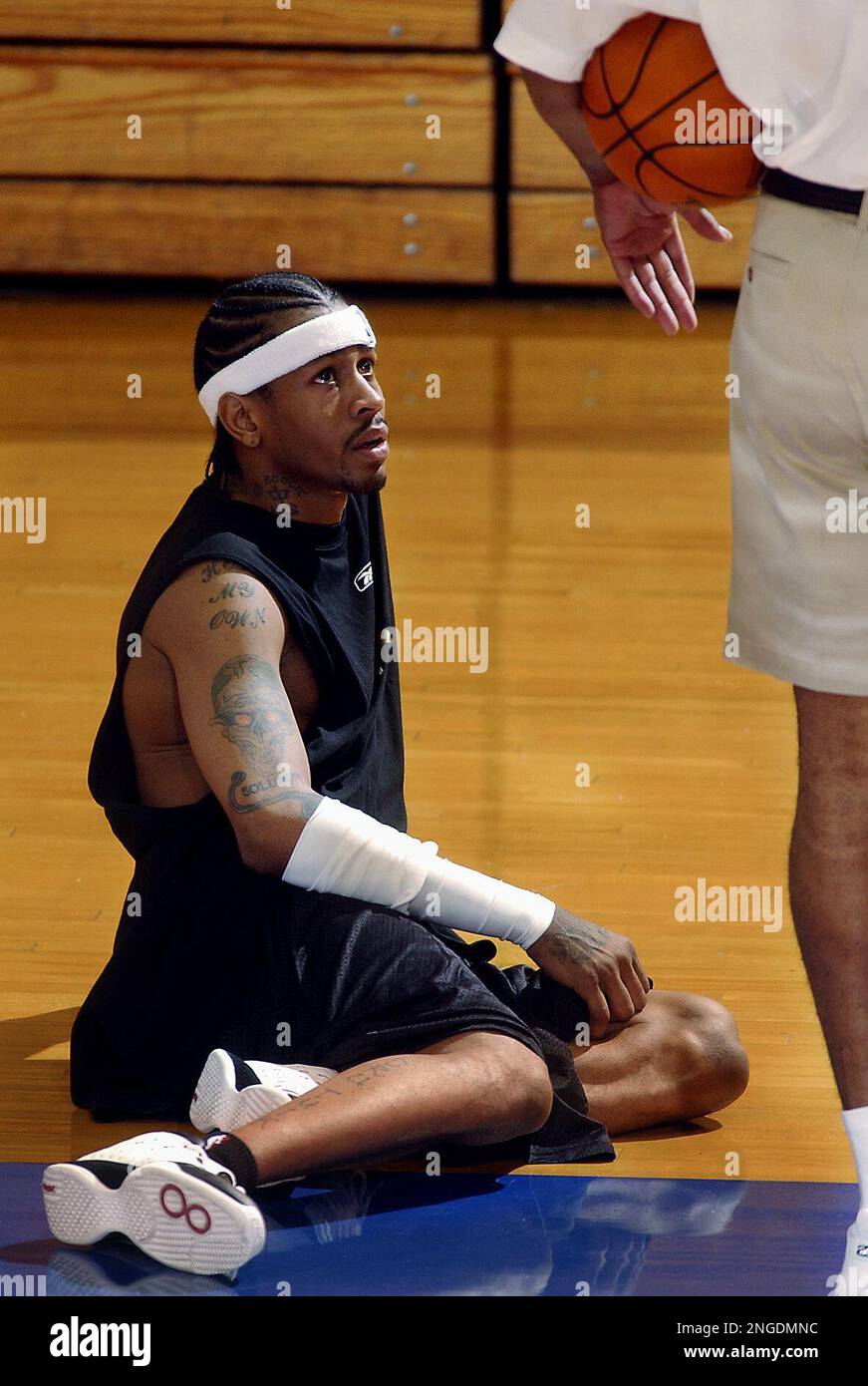 Philadelphia 76ers' Allen Iverson listens to an assistant coach during ...
