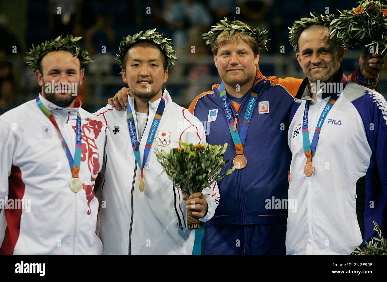 Silver medalist Russia's Tamerlan Tmenov, gold medalist Keiji Suzuki of ...