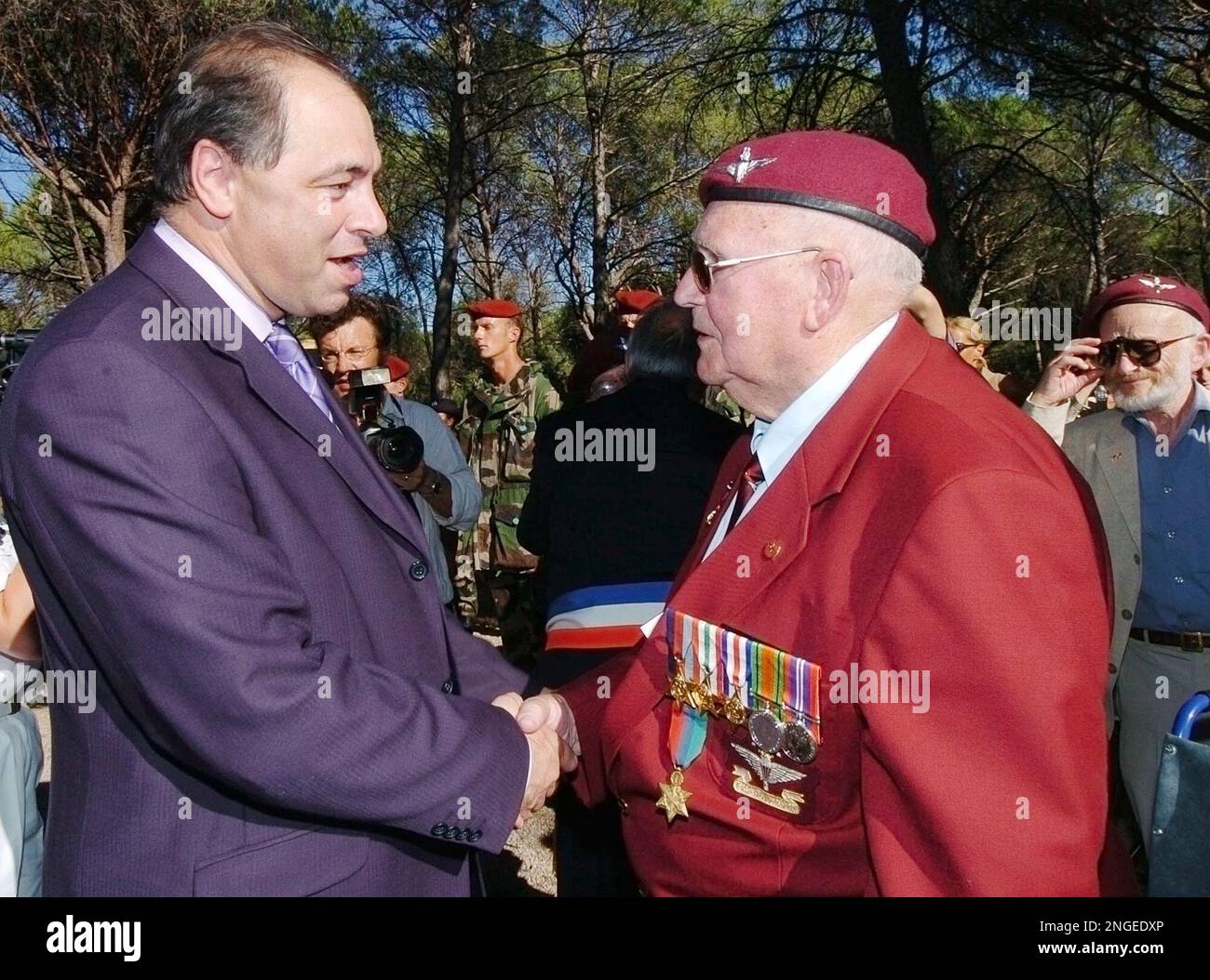 British Veteran's Minister Ivor Caplin, left, shakes hands with British ...