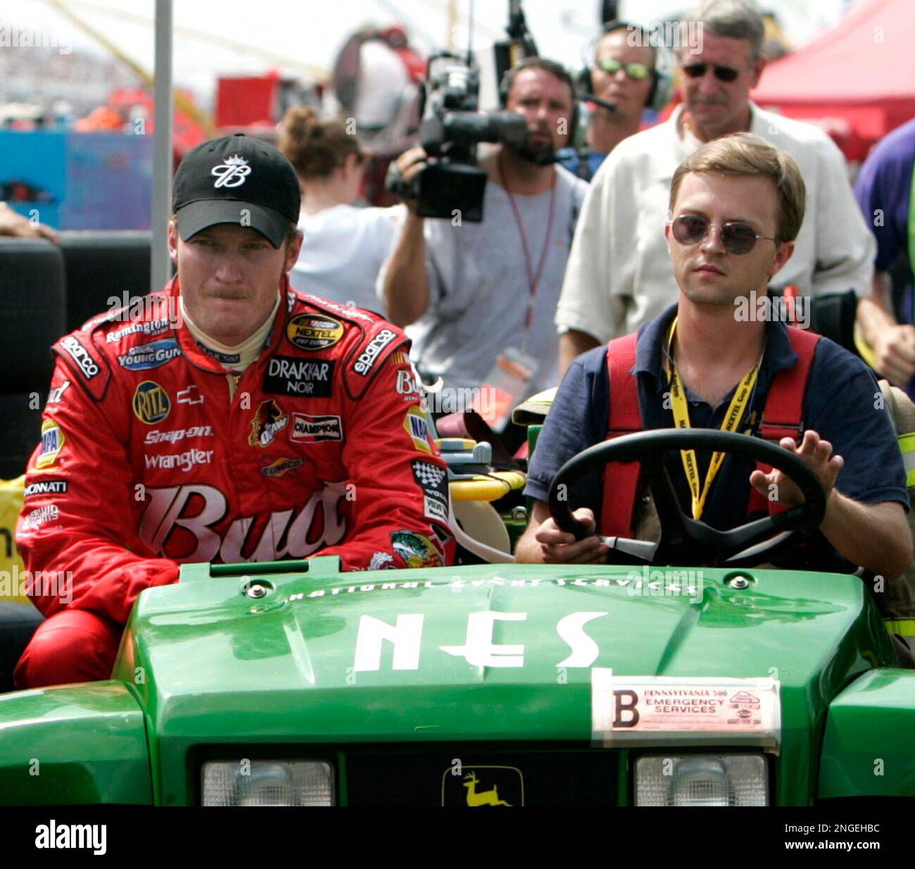 Dale Earnhardt Jr., left, is driven from the race track by medical ...