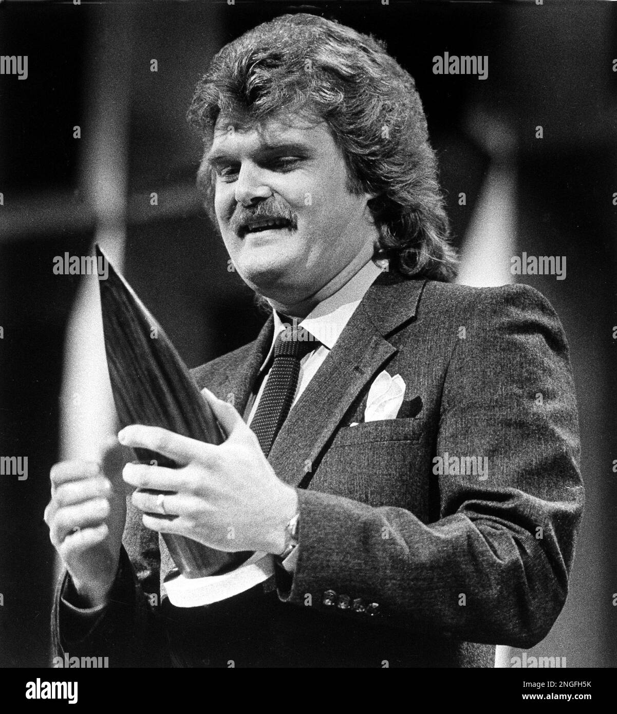 American Country Music singer Ricky Skaggs accepts his award as the ...