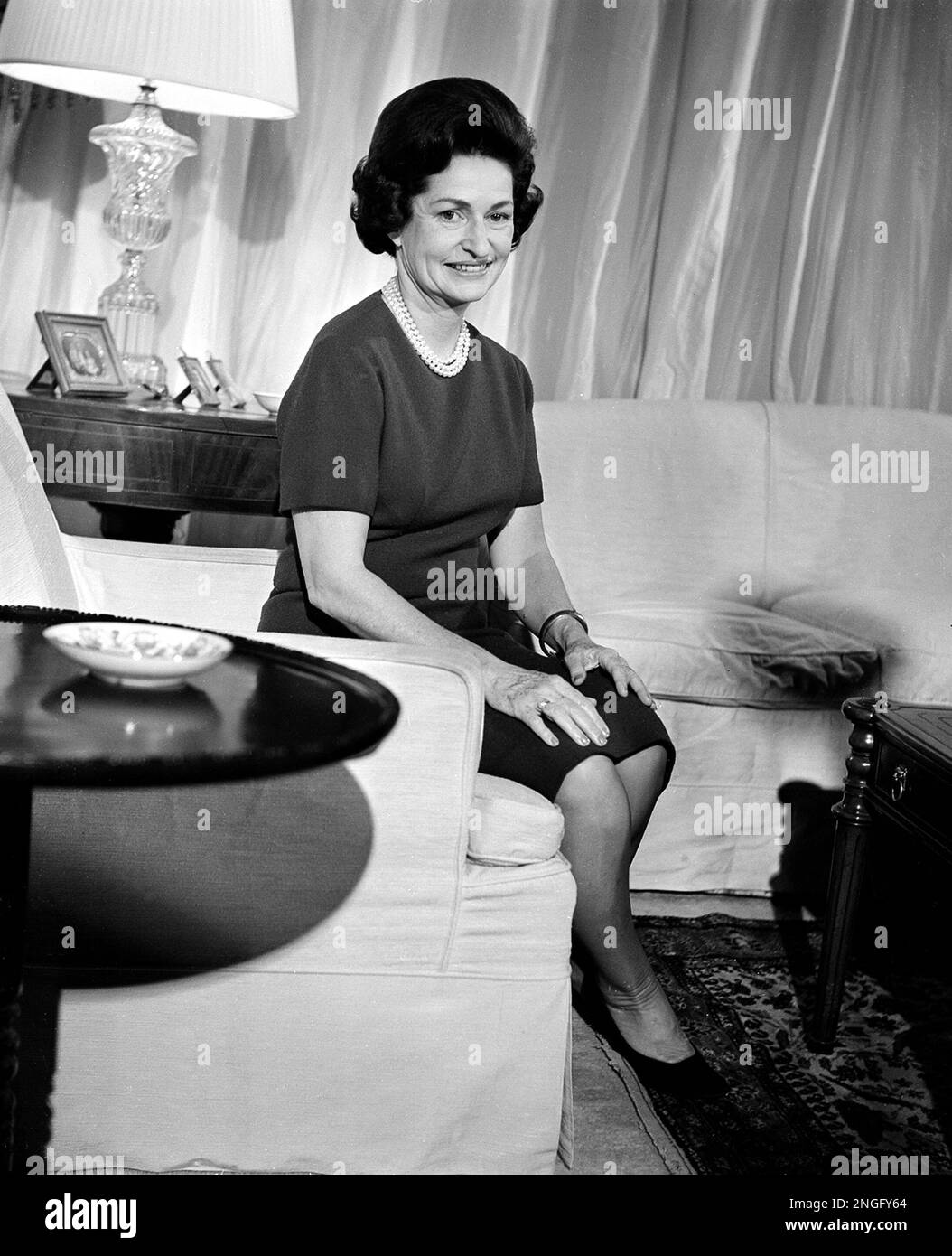 Lady Bird Johnson poses for a birthday portrait in a family sitting ...