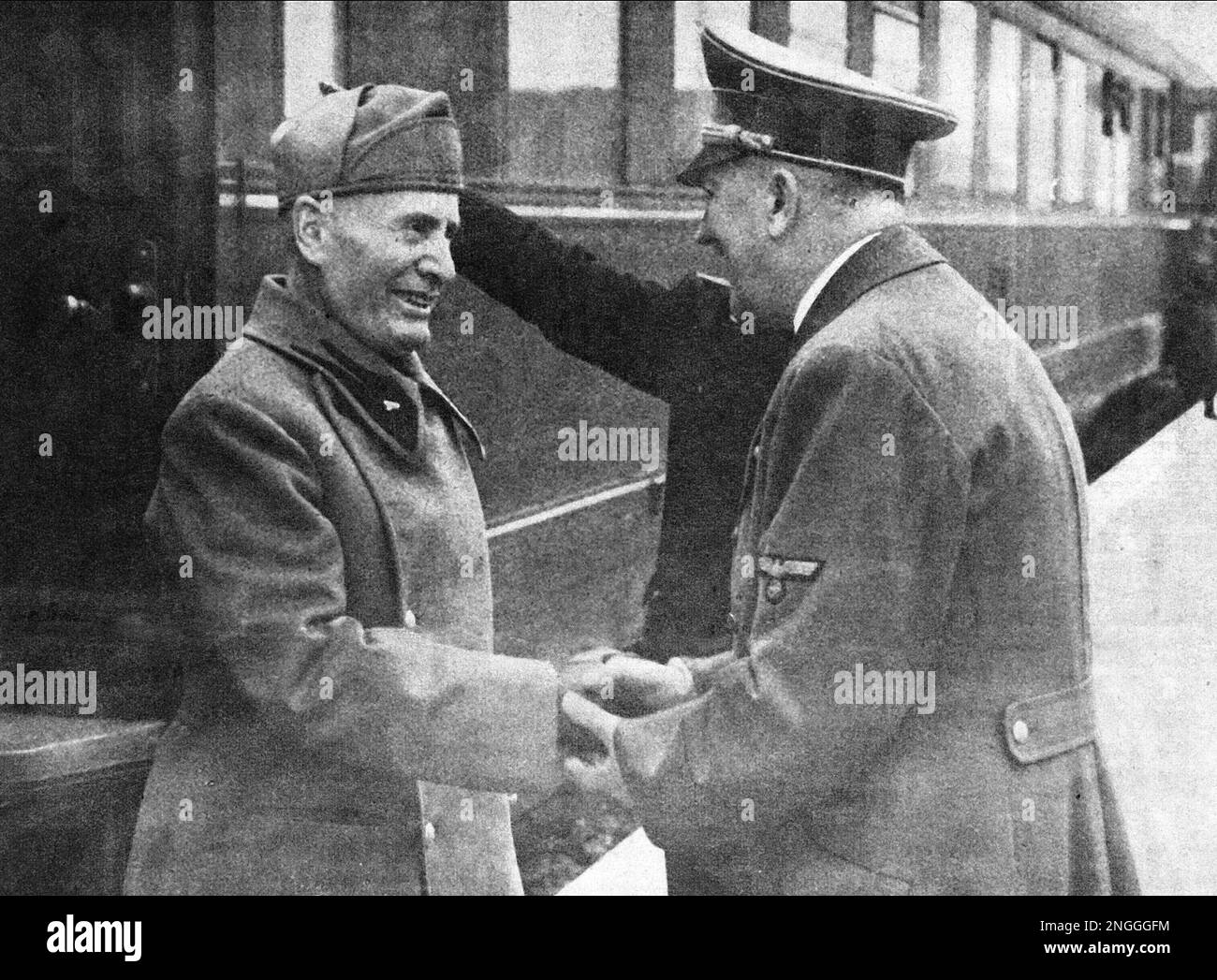 Italian Prime Minister Benito Mussolini, left, and Adolf Hitler shake ...