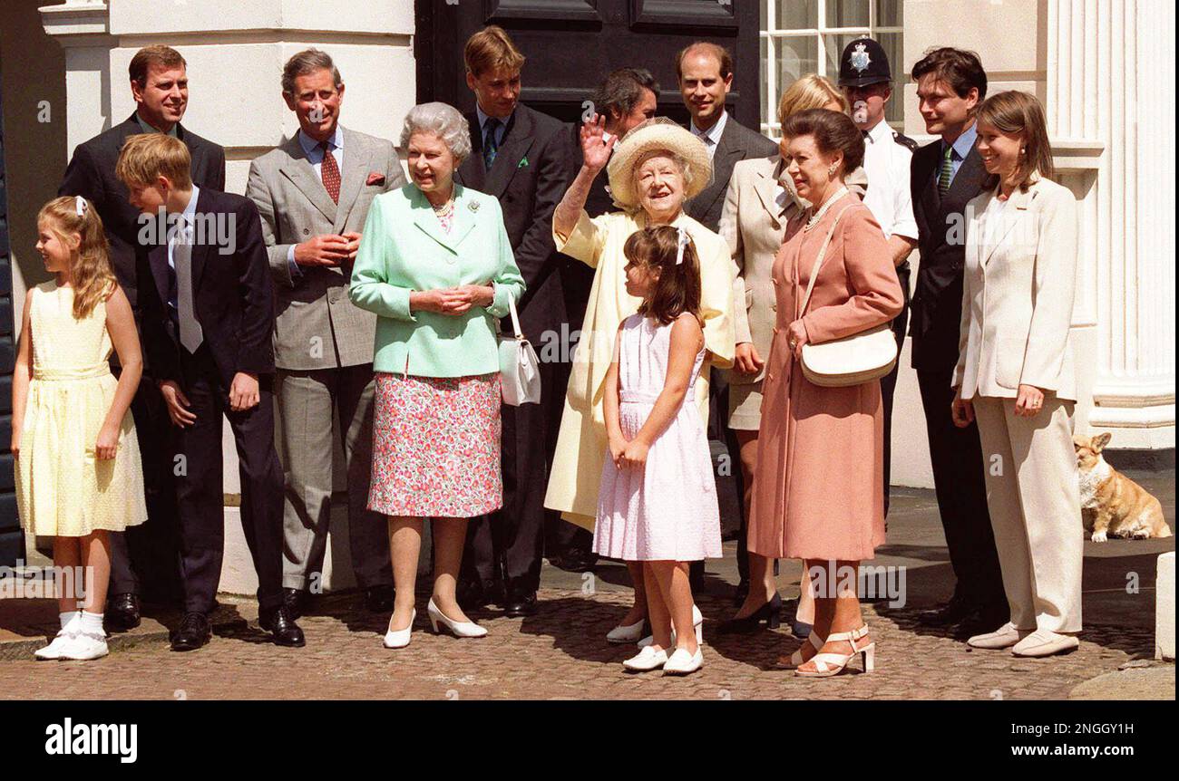 Britain's Queen Elizabeth, the queen mother, waves as she poses with ...