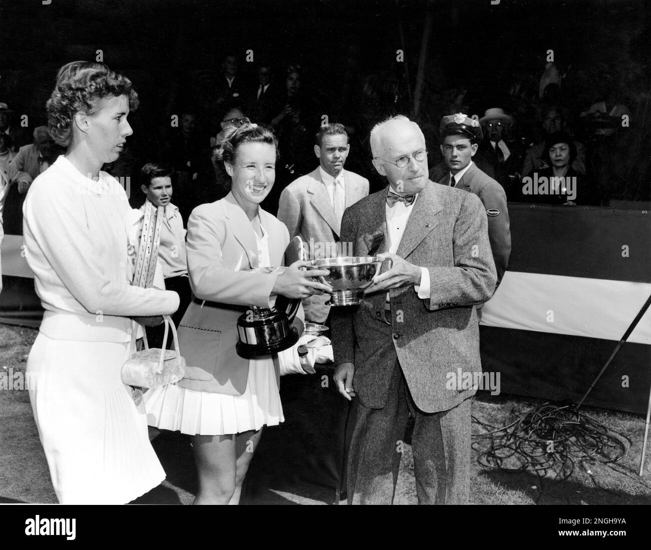 Maureen "Little Mo" Connolly, 17, is presented a trophy from Dr ...