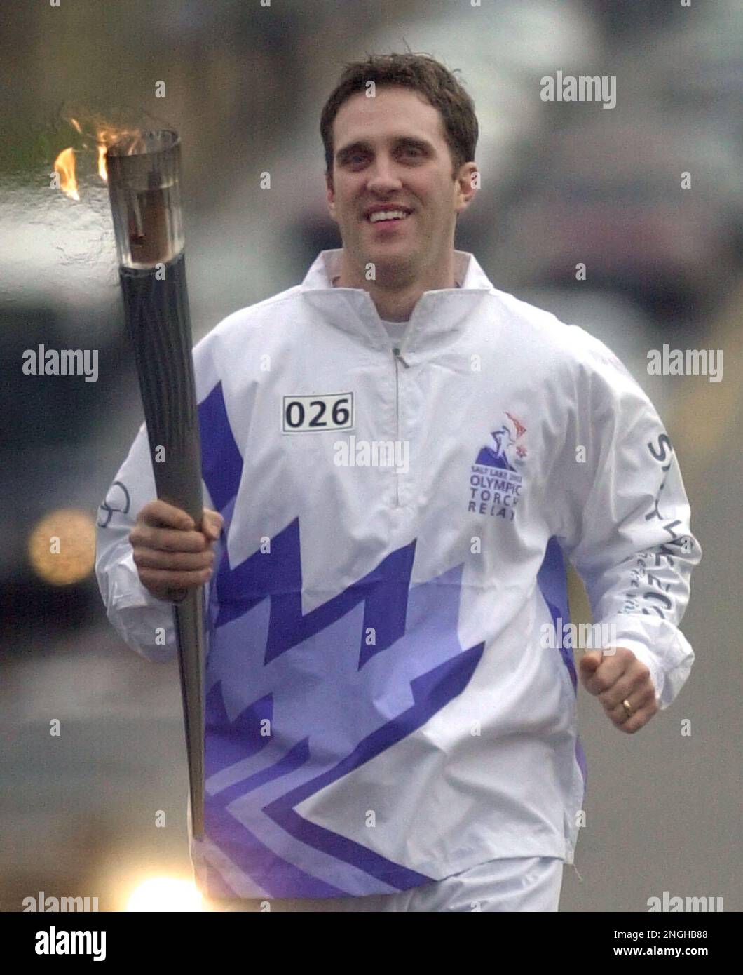 Nashville Predators goaltender Mike Dunham carries the Olympic torch on ...